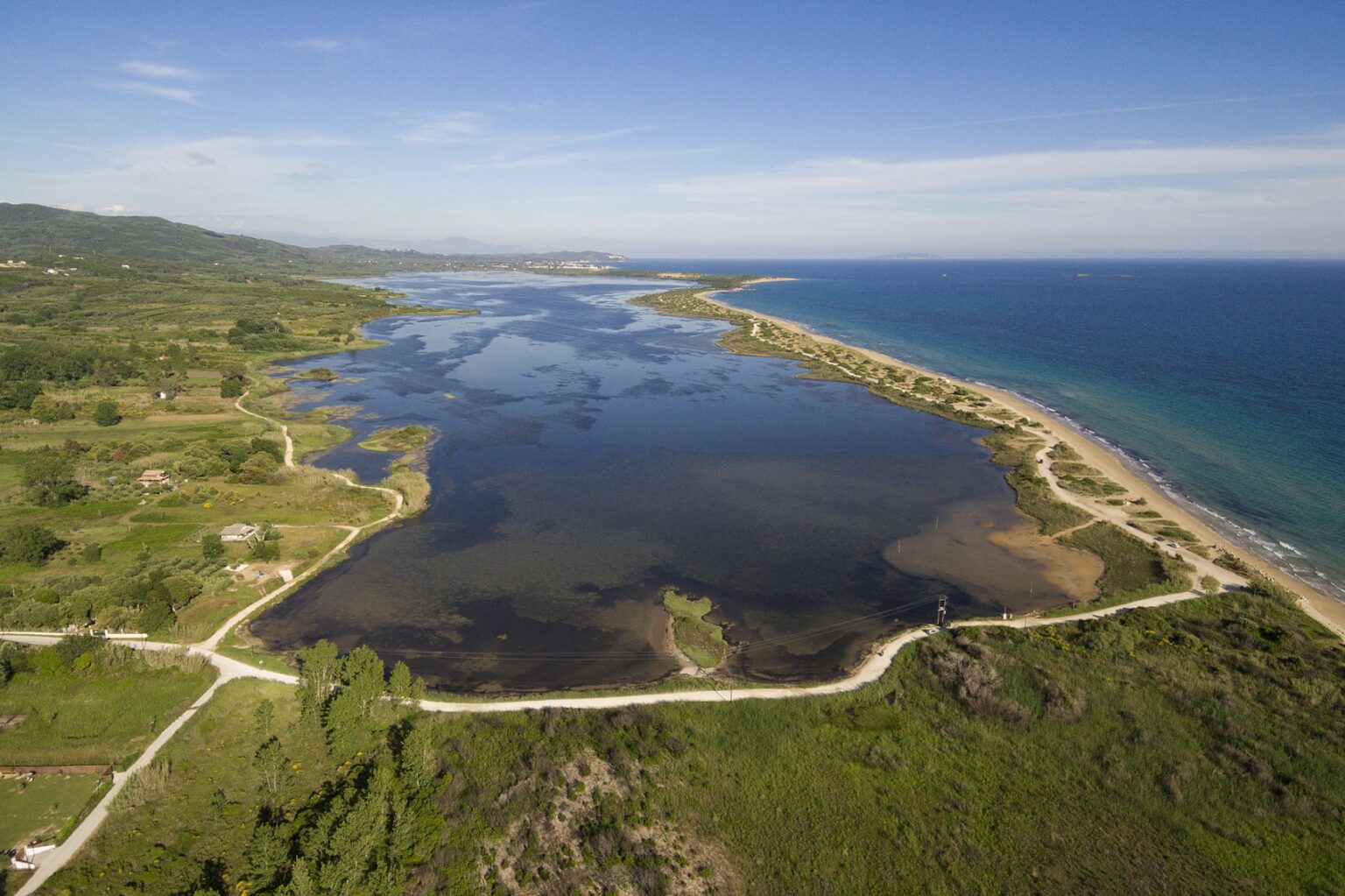 The Lagoon in Corfu with Sand Dunes and a Cedar Forest| travel.gr